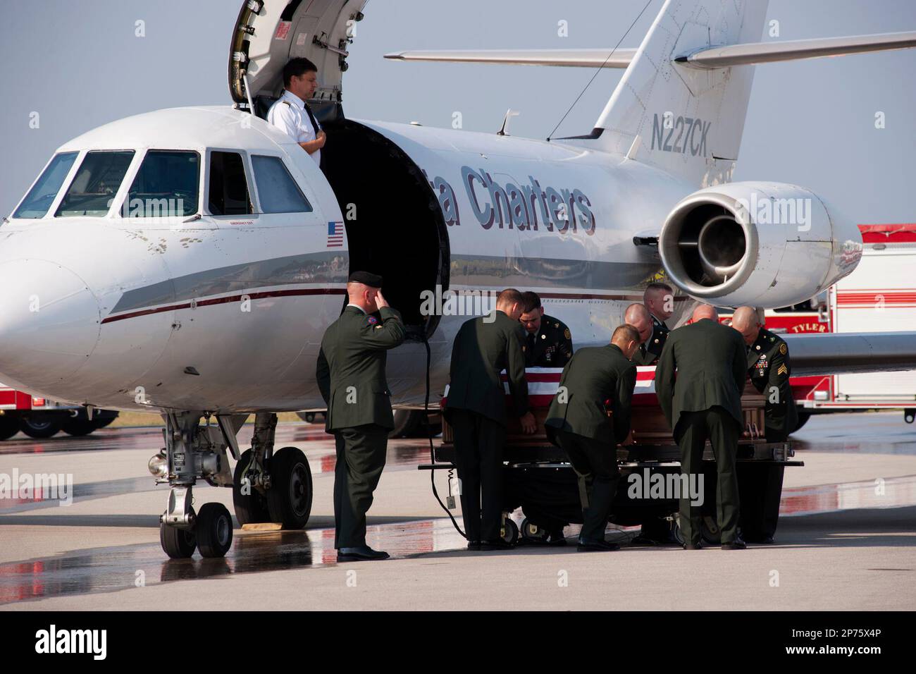The body of U.S. Army Sgt. Joshua David Powell, 28, is removed from a ...