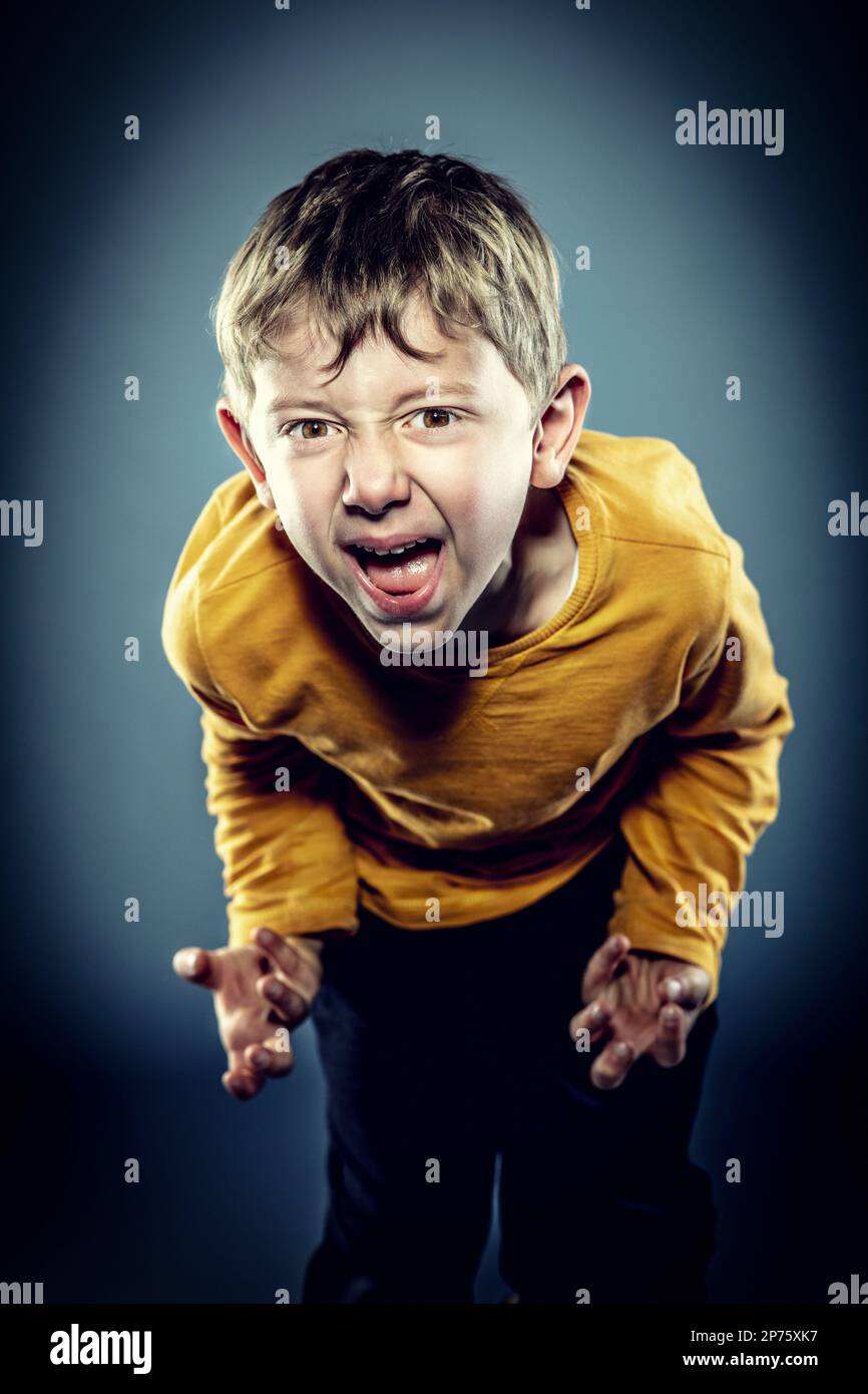 angry caucasian child studio shot Stock Photo - Alamy