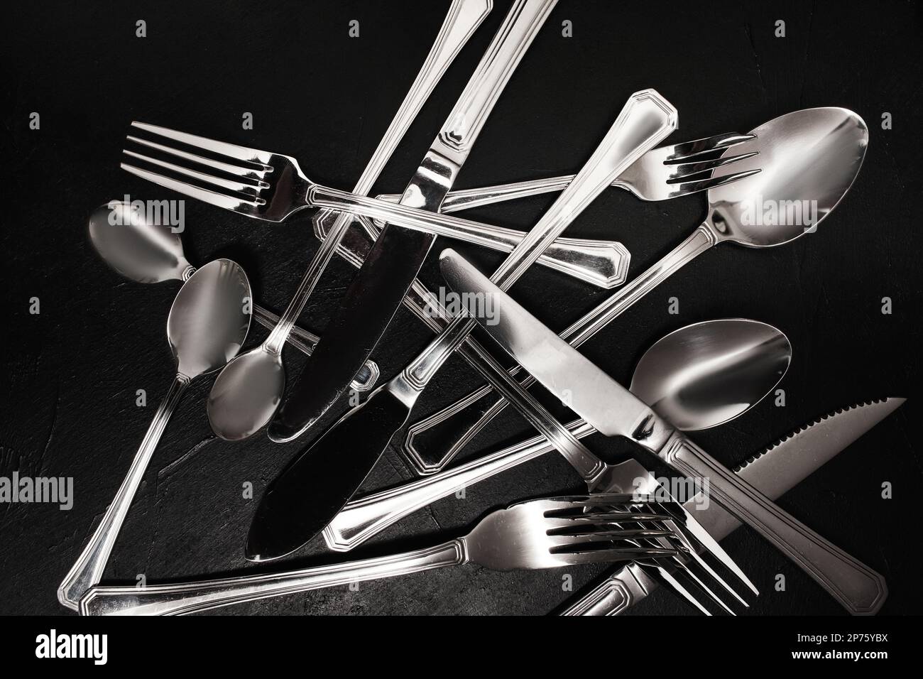 silver flatware set afterparty cleaning Stock Photo - Alamy
