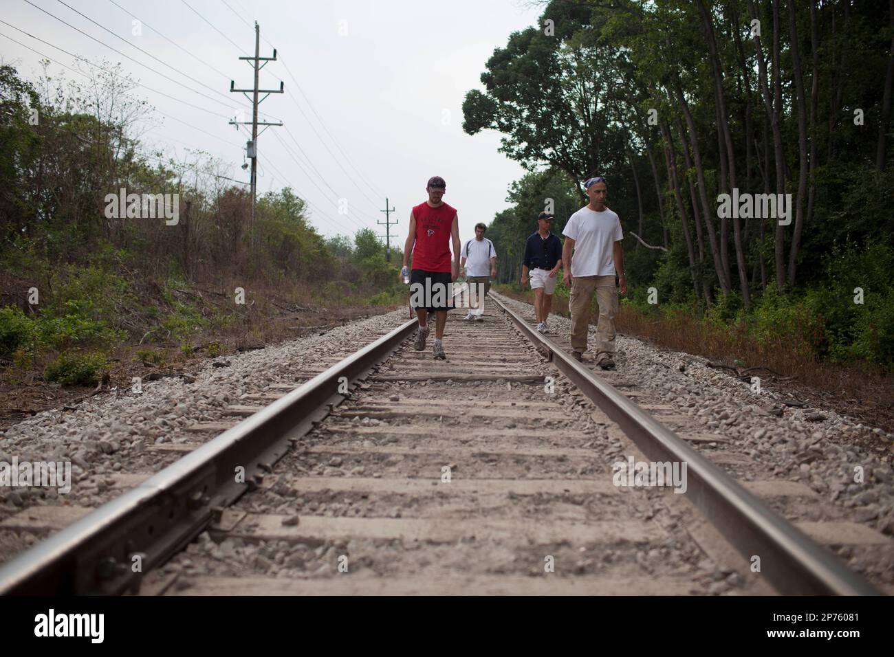 Volunteers searches train tracks on Bloomington's east side in hopes of ...