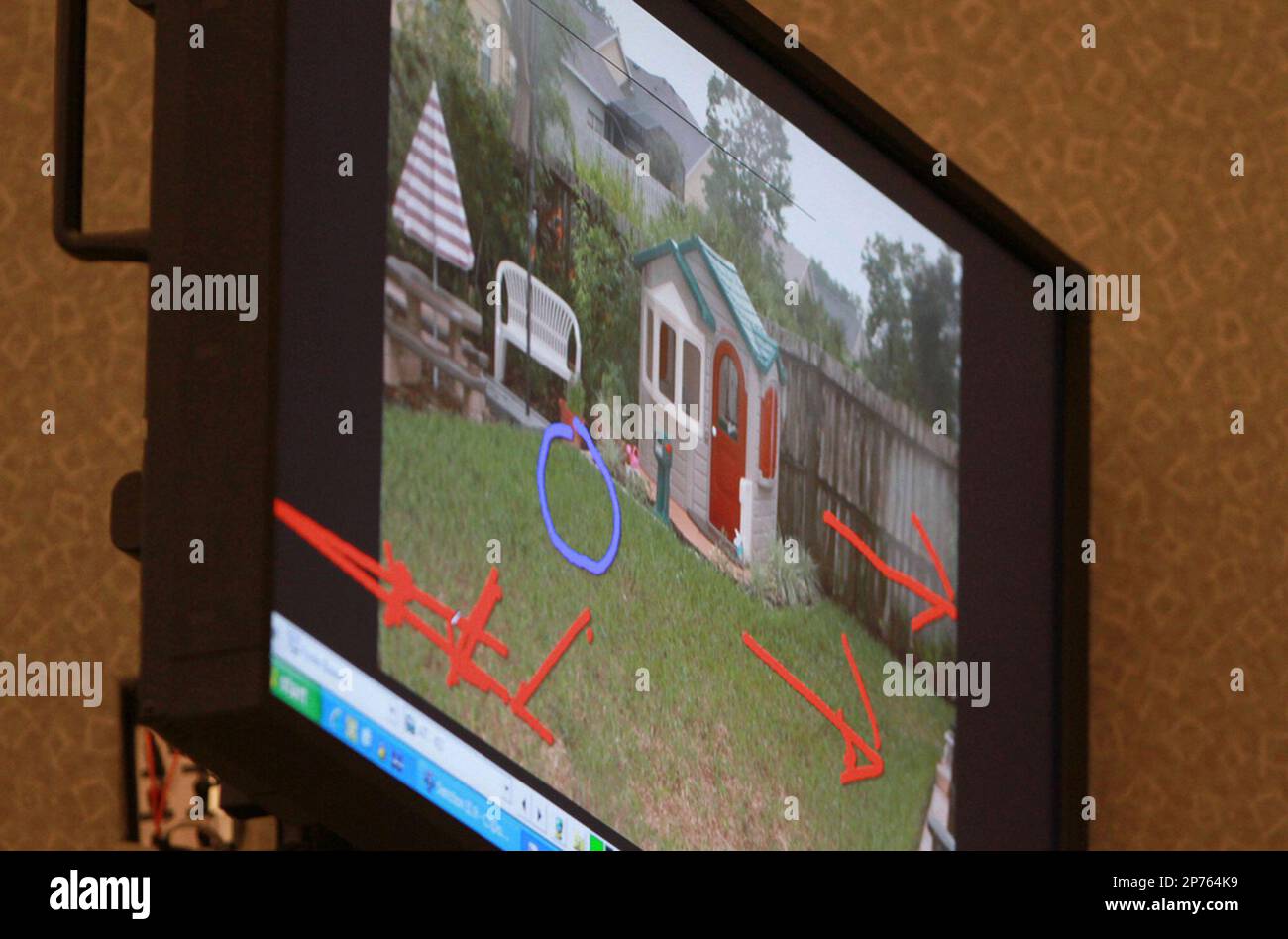 A photo entered into evidence is shown on a courtroom monitor during ...