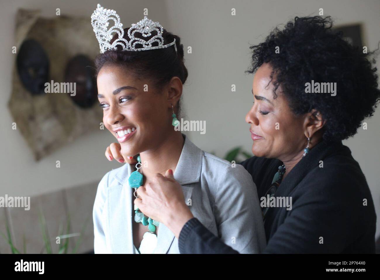 Rhoda Johnson helps her daughter Chloe, left, this year's Miss Black ...