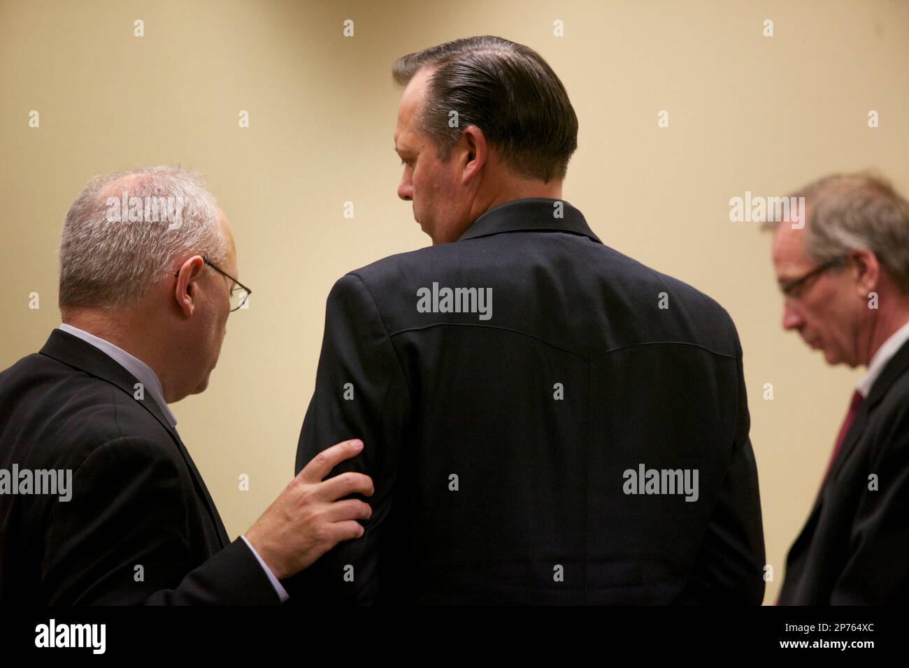 Timothy Wyland is flanked by his attorneys, Mark Cogan, left, and John ...