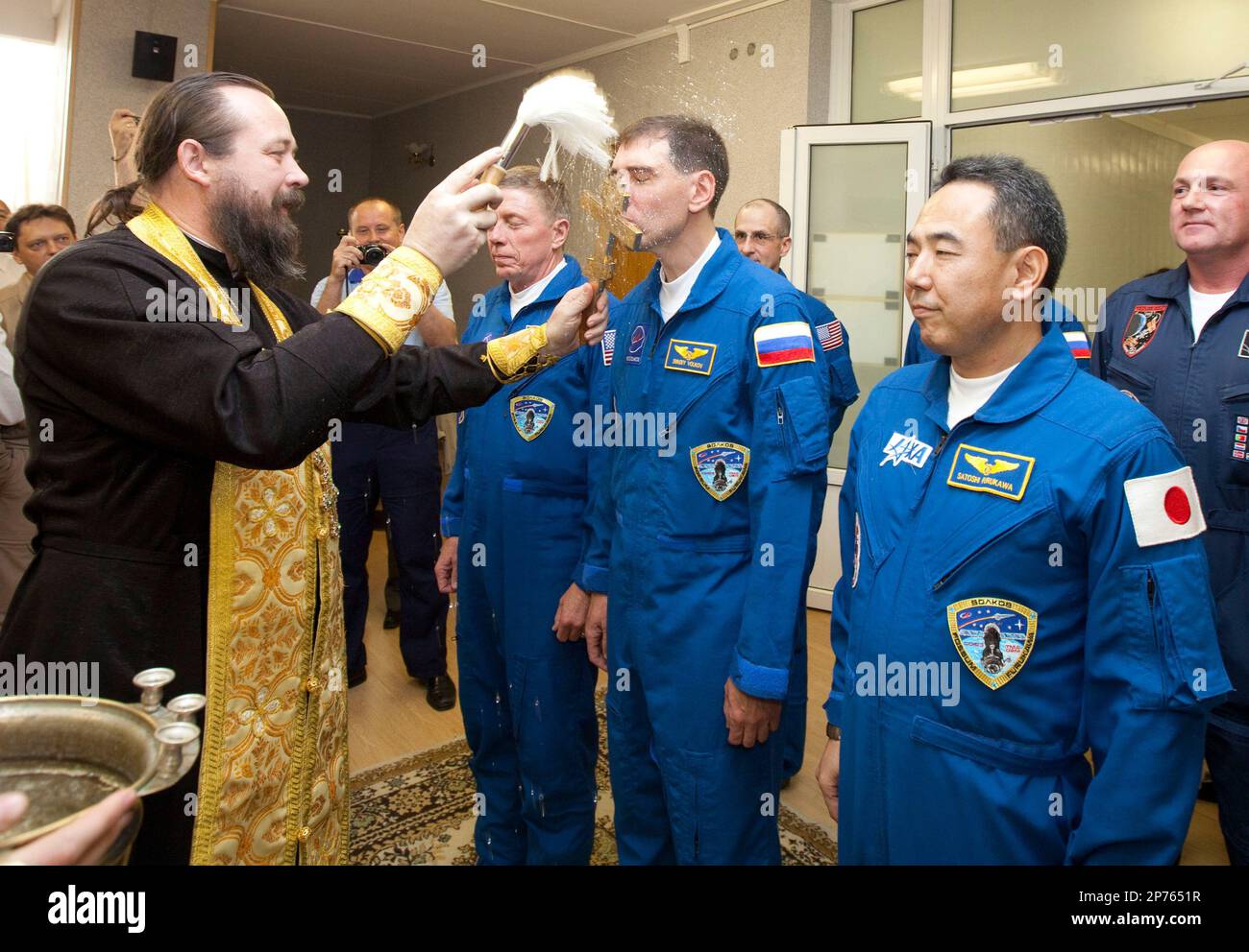 A Russian Orthodox priest blesses the International Space Station crew ...