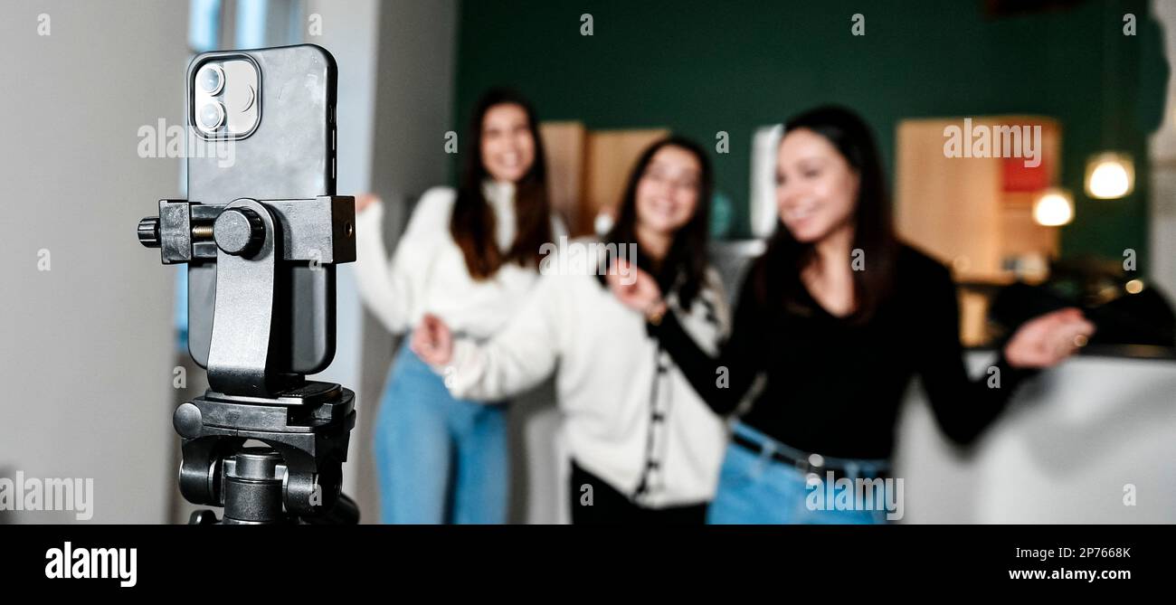 Illustration picture shows a phone (smartphone) on a tripod filming 3 ...