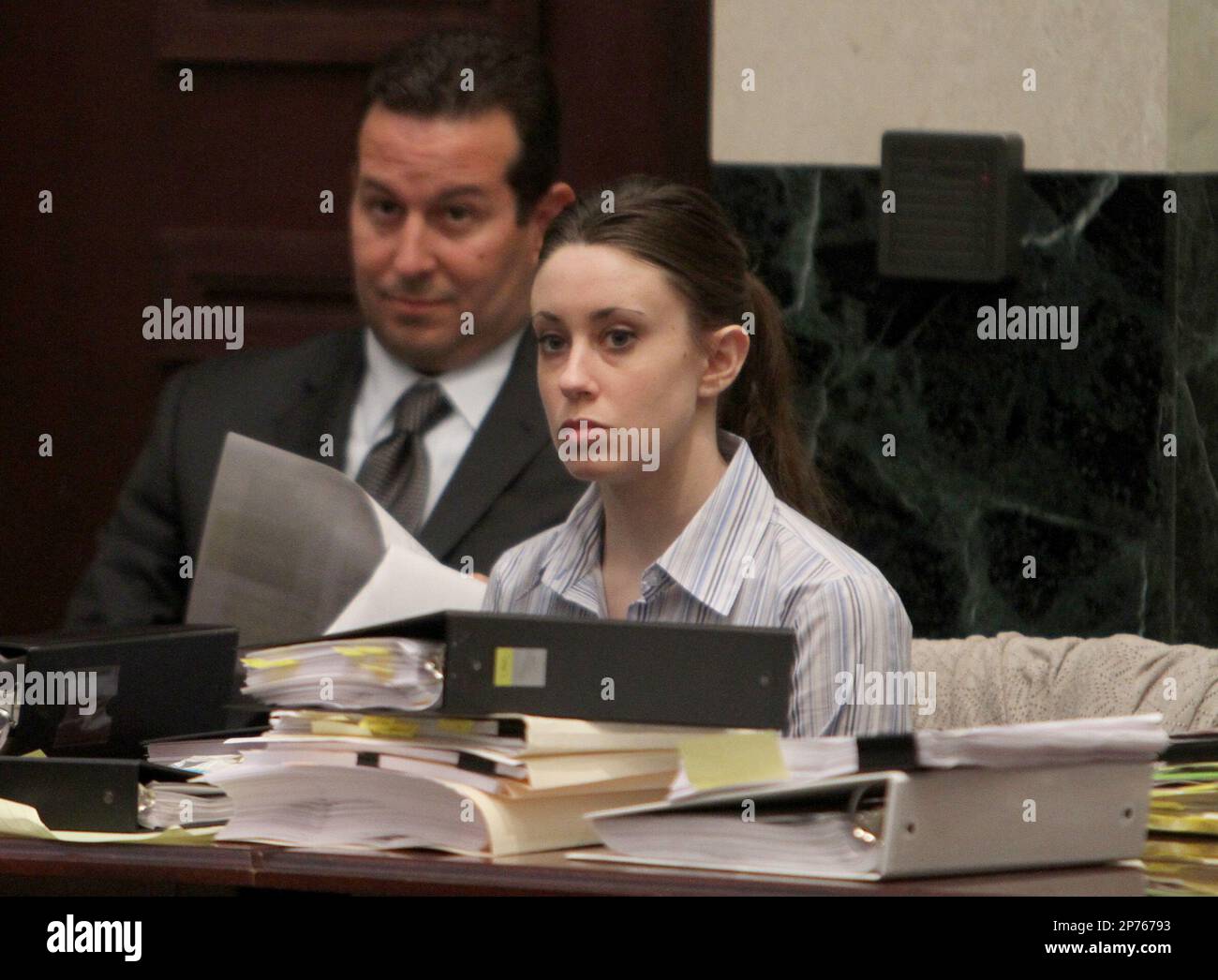 Casey Anthony sits at the defense table with her attorney Jose Baez ...