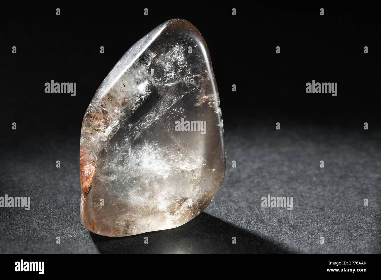 Tumbled Smoky Quartz Crystal on Dark Background Back Lit Showing its ...