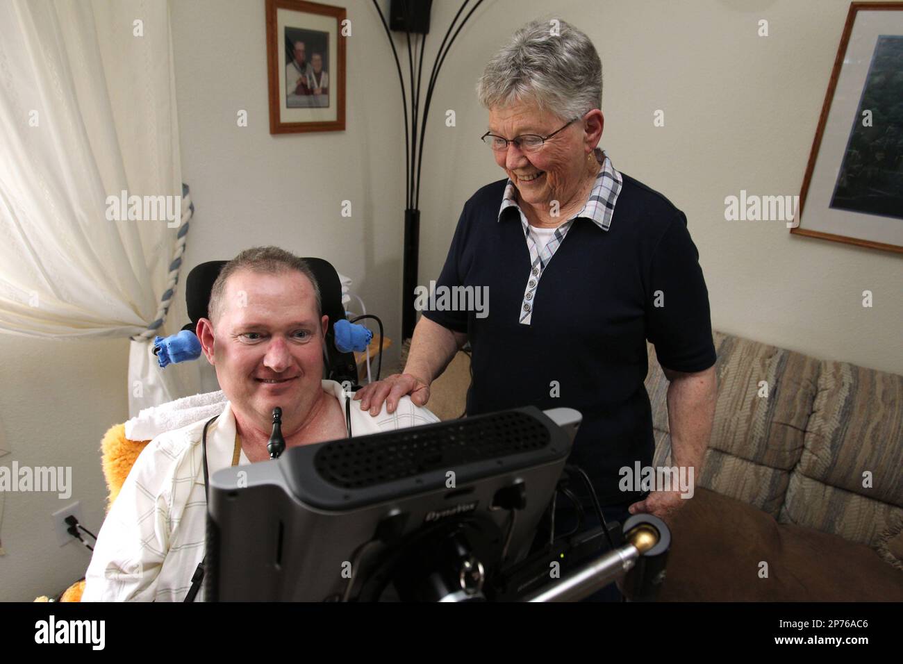 Sandra Thomason jokes with her son, Martin Thomason, at his home east ...