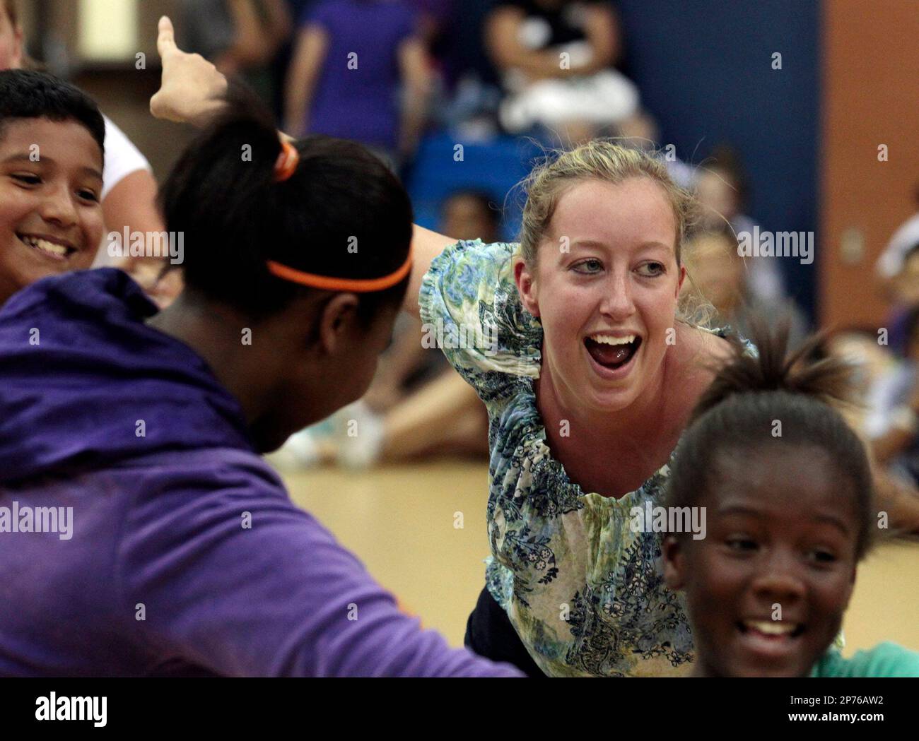 In this Tuesday, May 31, 2011 photo, Mindi Garcia encourages her class in the tug of war during ...