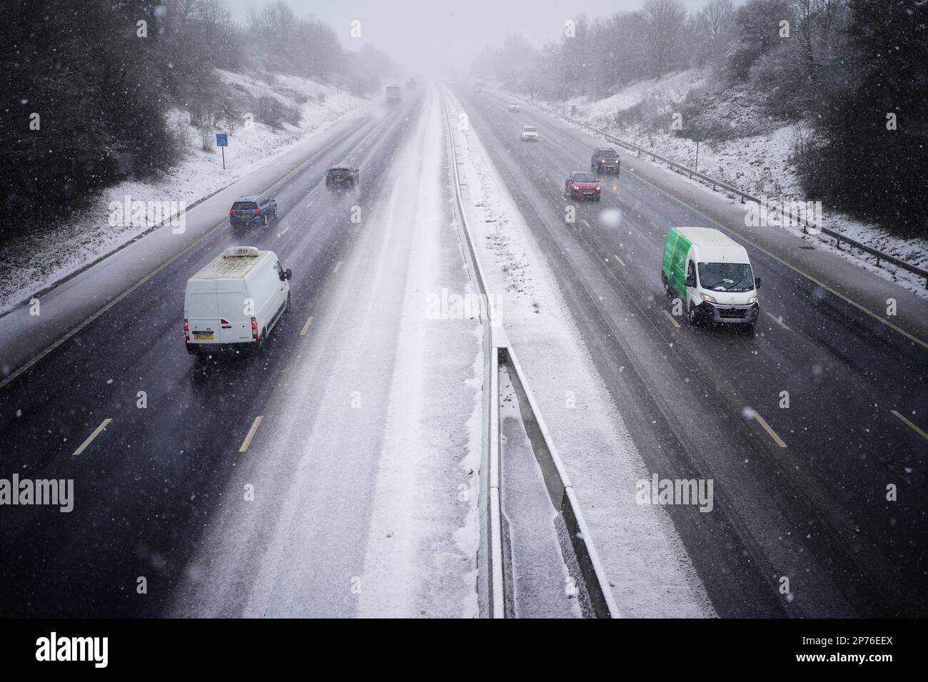Cars driving through snow on the the M5 motorway near Taunton, which ...