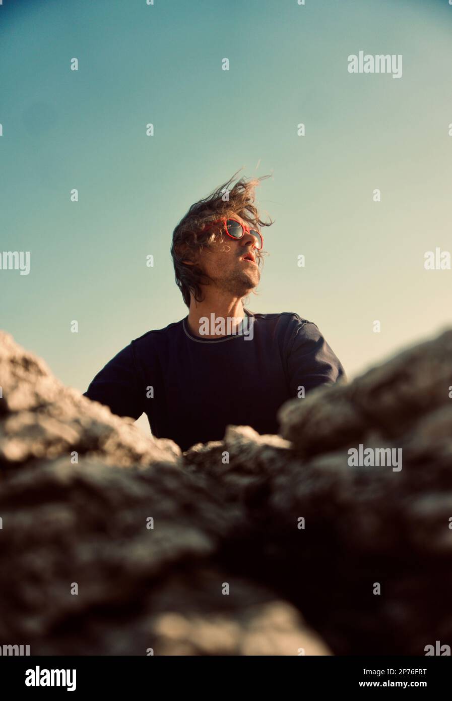 Man framed in rocks hi-res stock photography and images - Alamy