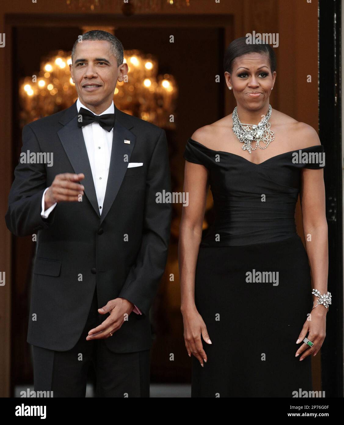 US President Barack Obama and First Lady Michelle Obama wait for the ...