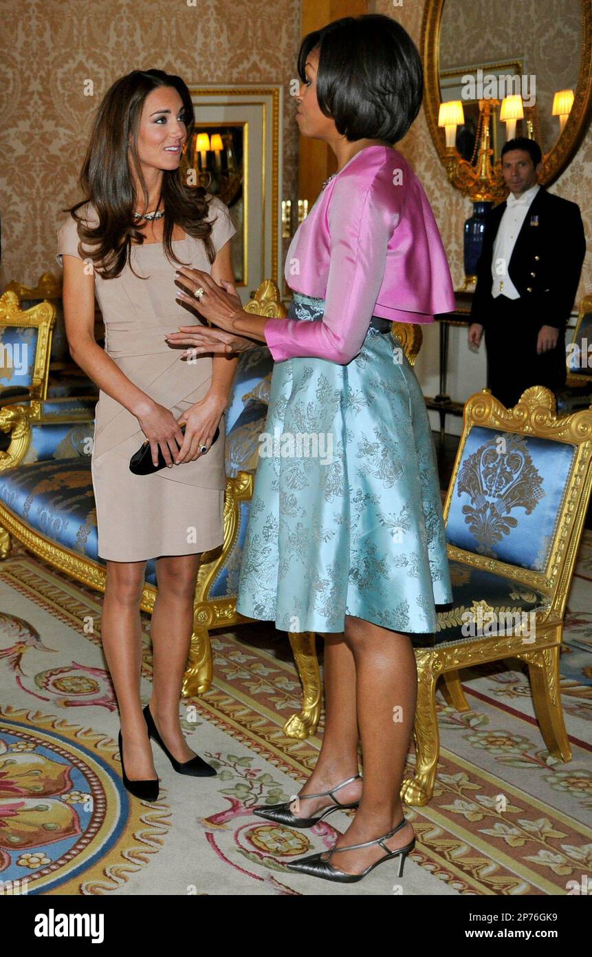 U.S. first lady Michelle Obama, right, talks to the Duchess of ...