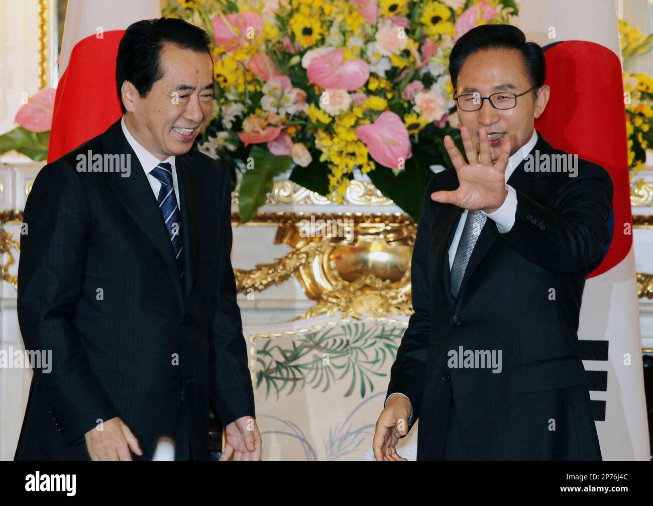South Korean President Lee Myung-bak, right, gestures as Japanese Prime ...