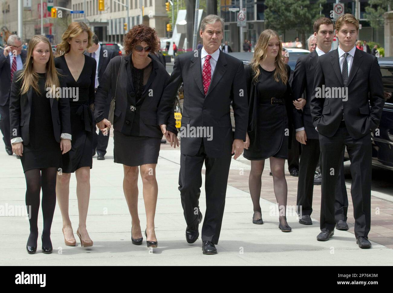 Michael McCain, center, and his family arrive for the funeral of his ...