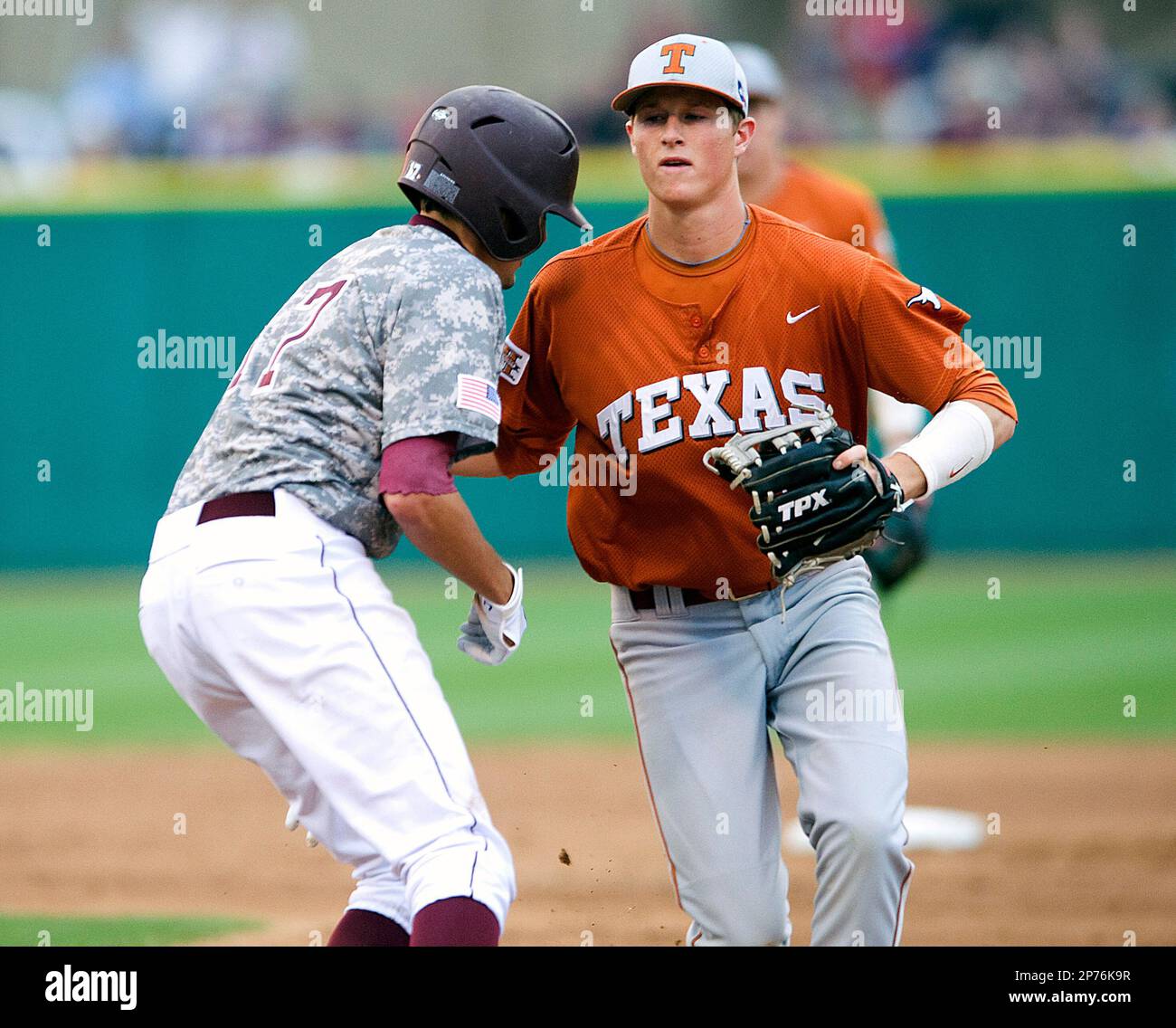Texas' Erich Weiss catches Texas A&M's Matt Juengel in a rundown ...