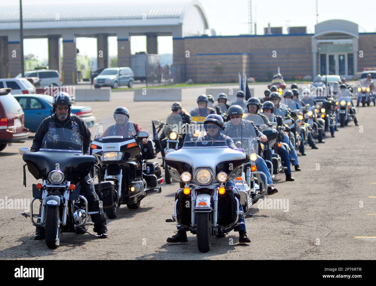 Members of the Patriot Guard wait at MBS International Airport to ...