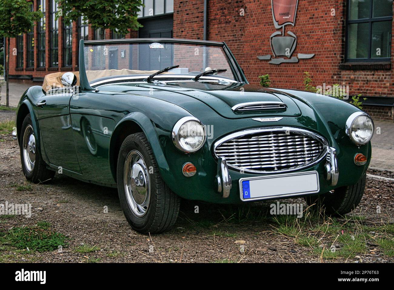 The green Austin-Healey car parked in a parking lot Stock Photo - Alamy