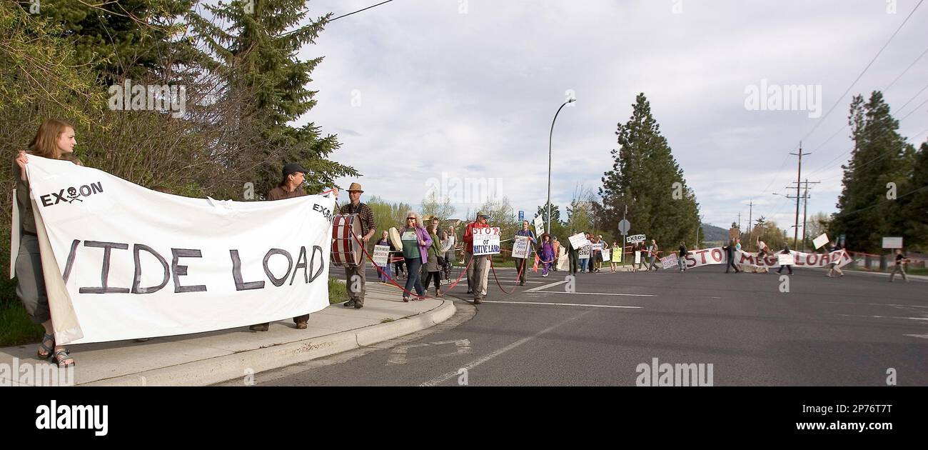 Danie Merriman, left, of Boise, Idaho leads protesters simulating a ...