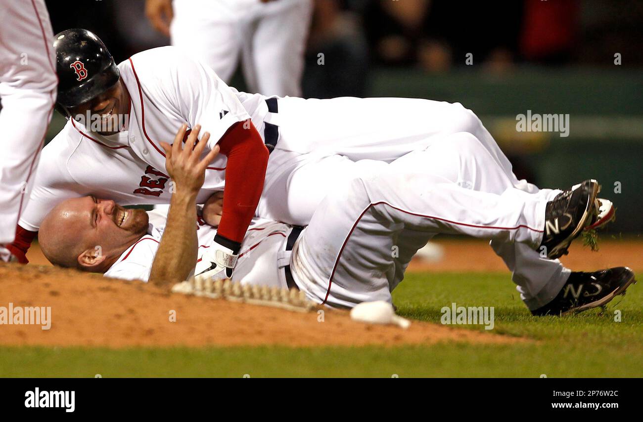 Boston Red Sox's Carl Crawford, top, celebrates with Kevin Youkilis ...