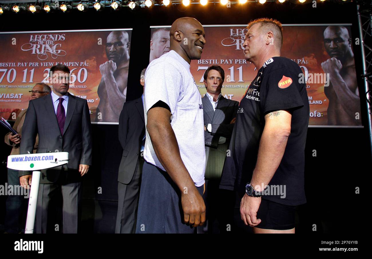 Evander Holyfield from USA, centre, at the weigh-in before the boxing ...