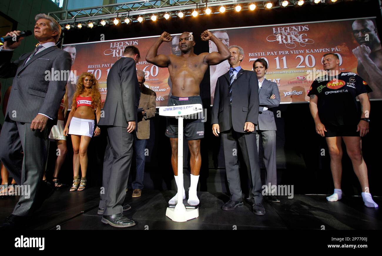 Evander Holyfield from USA, centre, at the weigh-in before the boxing ...