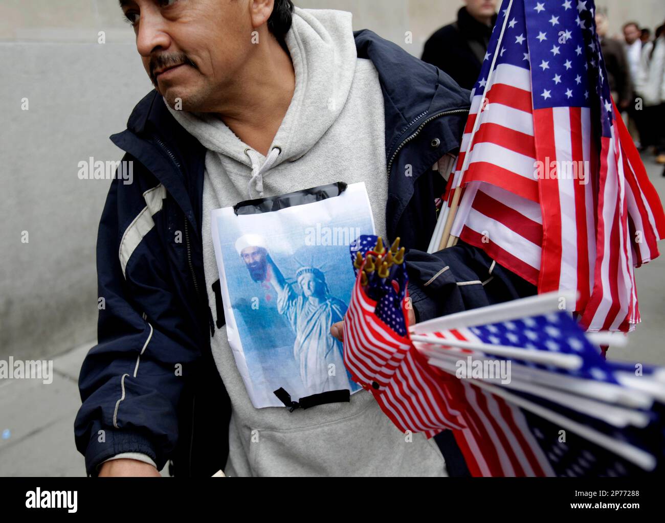 A poster showing the Statue of Liberty holding the head of Osama bin ...