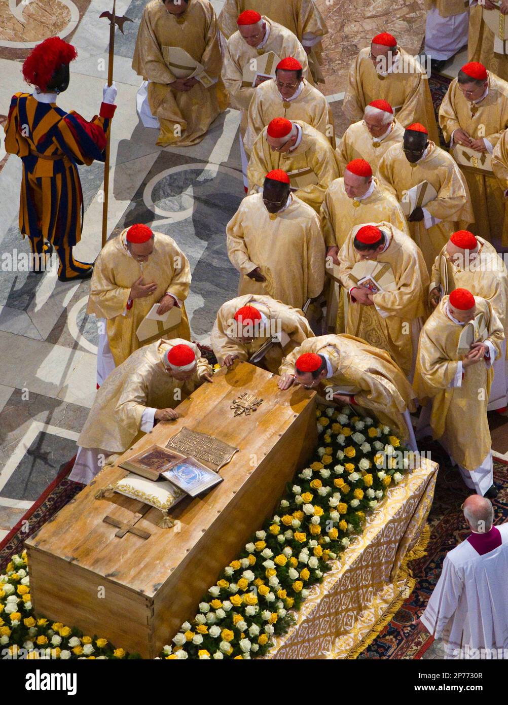 Cardinals kissf the casket of late Pope John Paul II, laid out in state ...