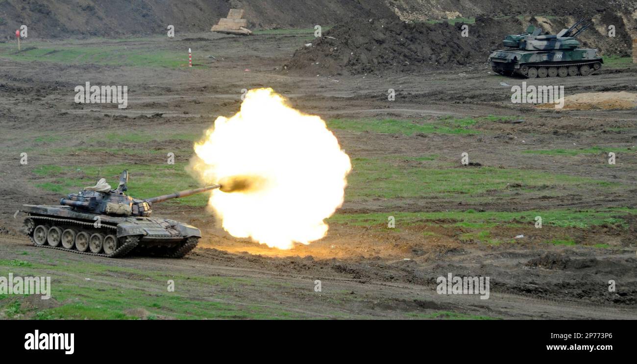 A Georgian army tank fires during Georgian army military exercises at ...