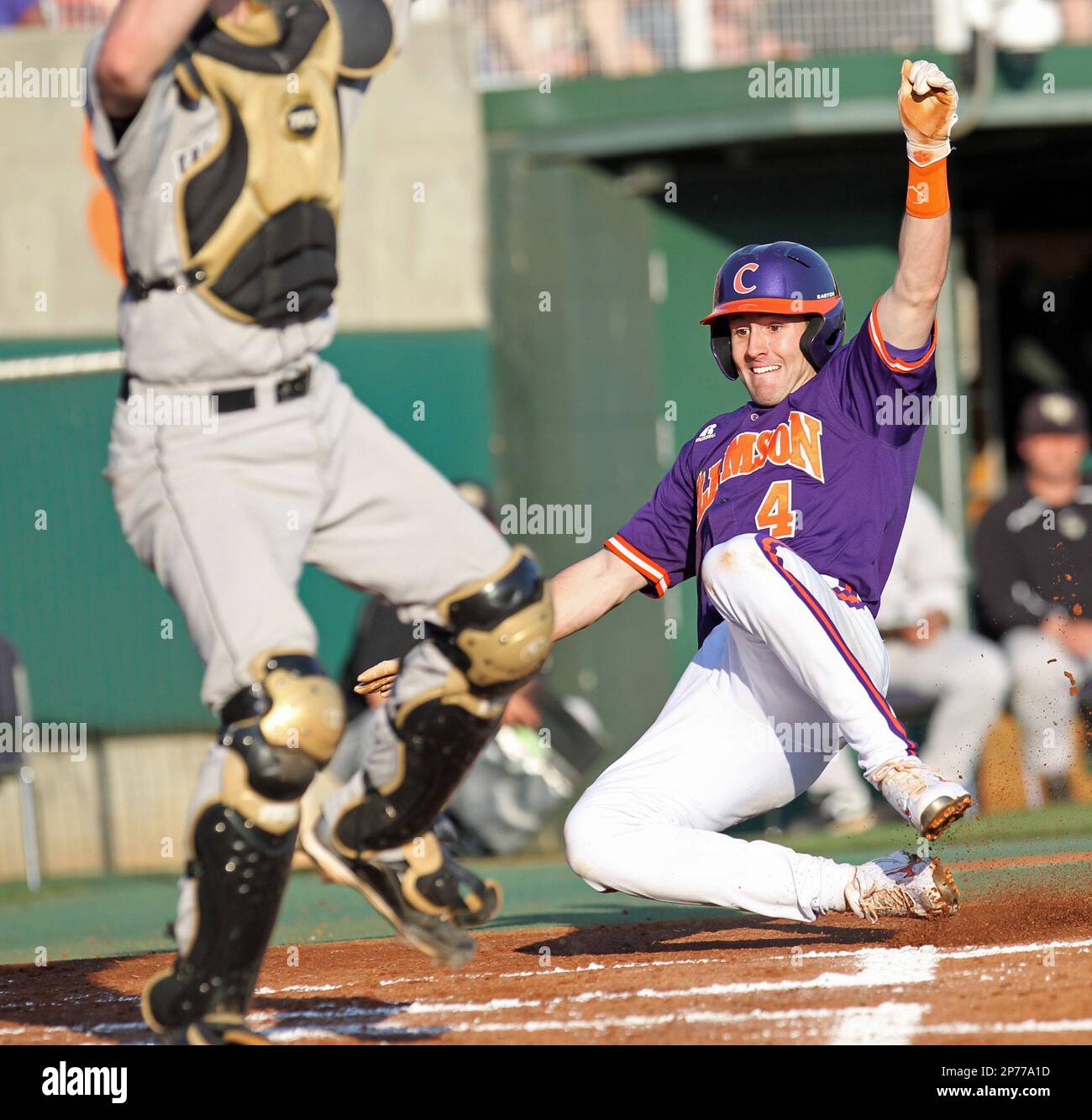 Clemson's John Hinson, right, scores in the first inning as Wake Forest ...