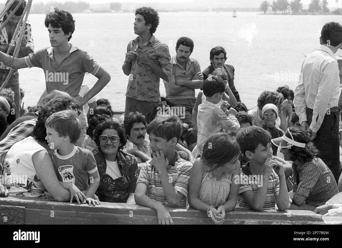 A group of Cubans wait to embark aboard a boat to U.S. shores at the ...