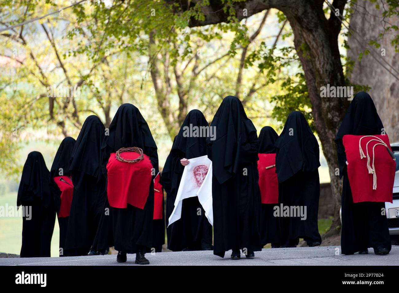 Veiled women known as "les Pleureuses" or mourning women, whose head is ...