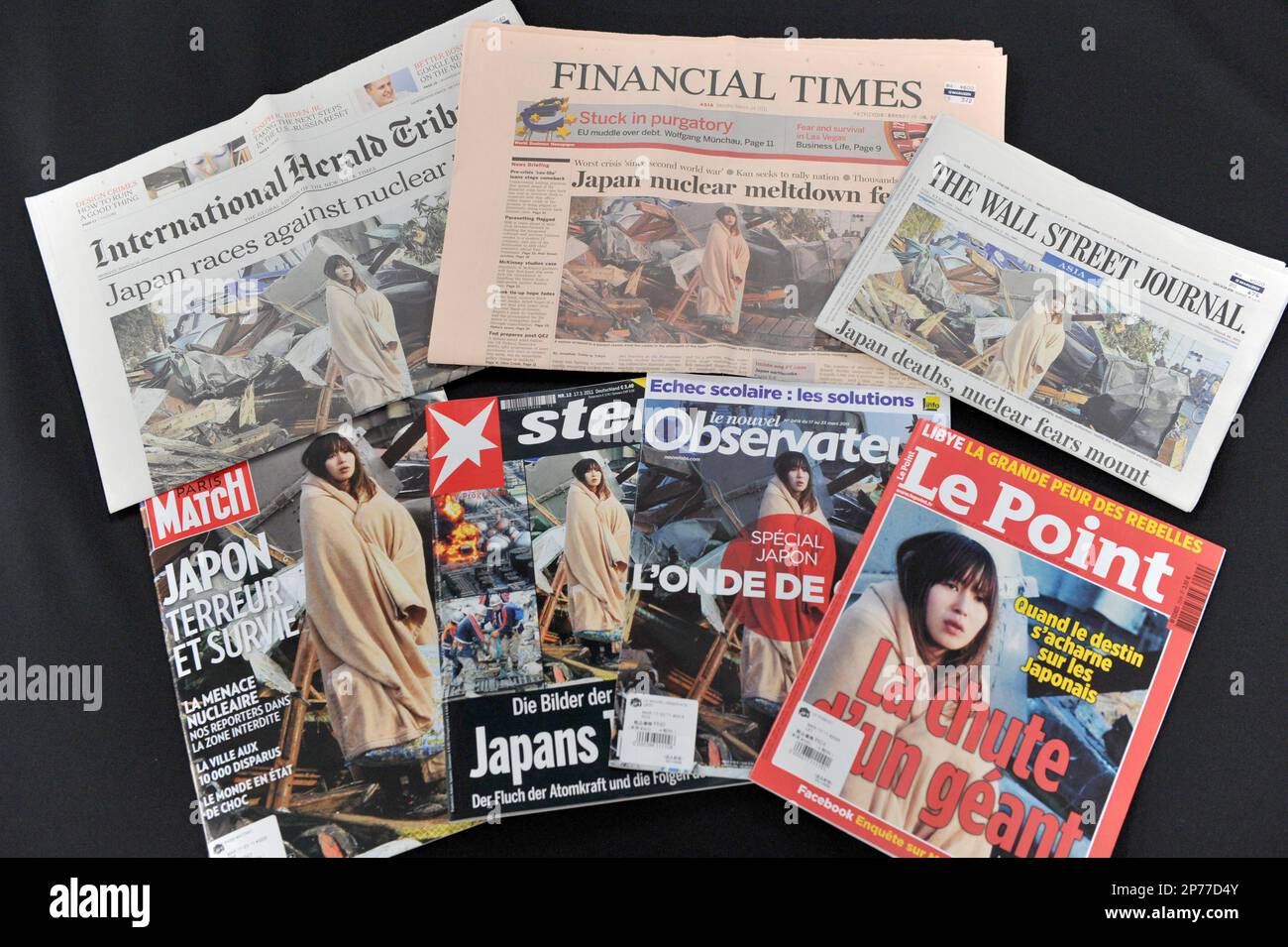 In this photo taken Tuesday, April 19, 2011, newspapers and magazines ...