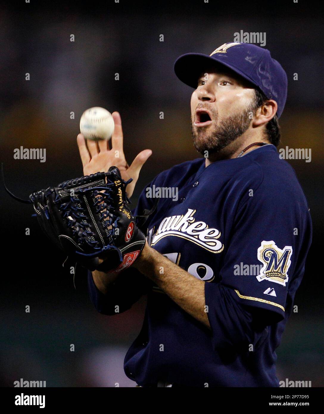 Milwaukee Brewers starting pitcher Shaun Marcum catches a ground ball ...