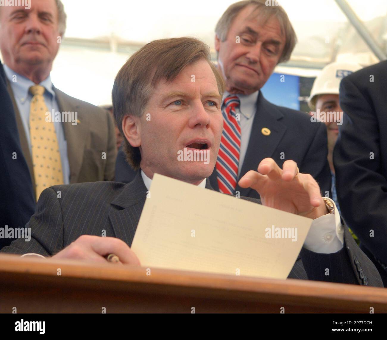 Surrounded by members of the General Assembly, Virginia Gov. Bob ...