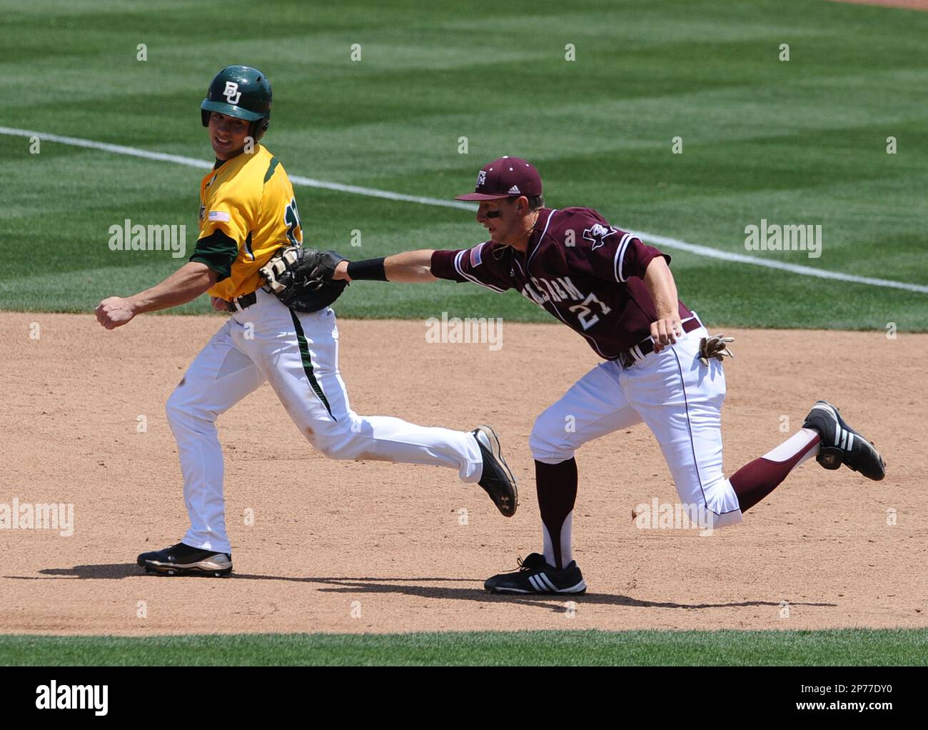 Baylor's Logan Vick, left, is tagged out by Texas A&M's Jacob House ...