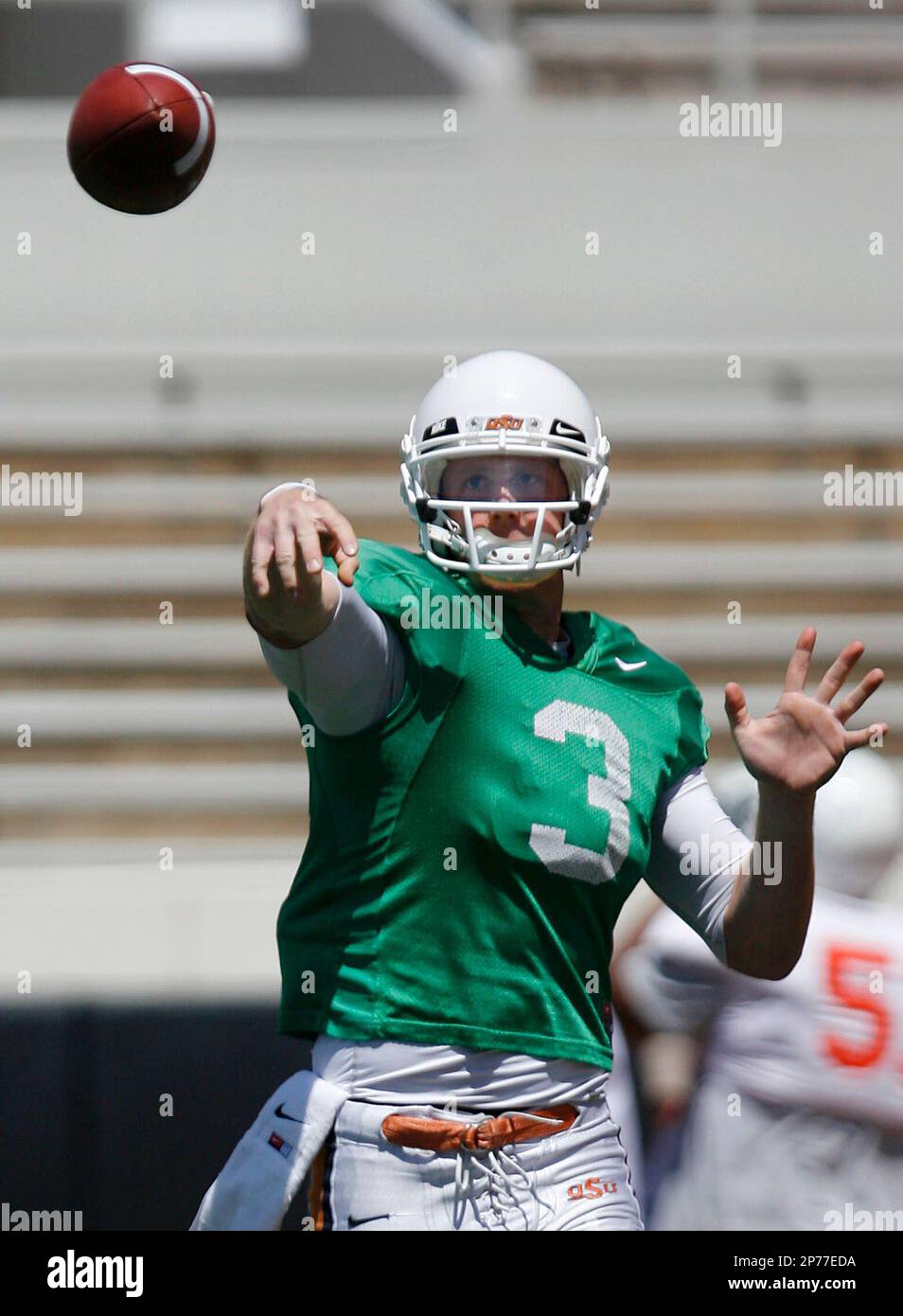 Quarterback Brandon Weeden passes during warm ups at Oklahoma State ...