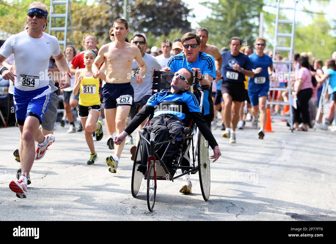 Marathon: Team Hoyt: .Father Dick Hoyt and son Rick Hoyt during a 5k ...