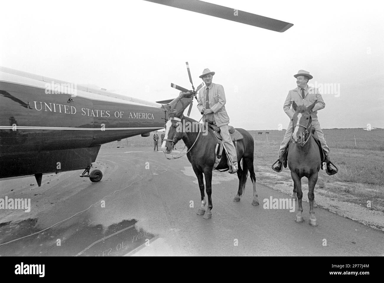 President Lyndon Johnson and VP Hubert Humphrey sit on horses next to ...