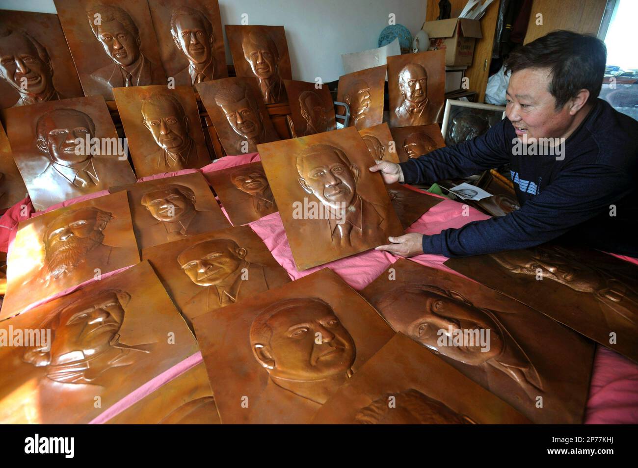 In this photo taken Friday, April 8, 2011, Chen Xueming holds up the ...
