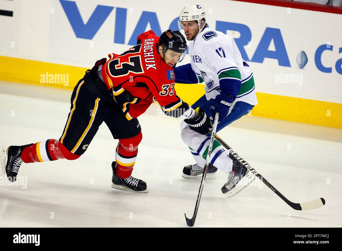 Vancouver Canucks' Ryan Kesler, right, works against Calgary Flames ...