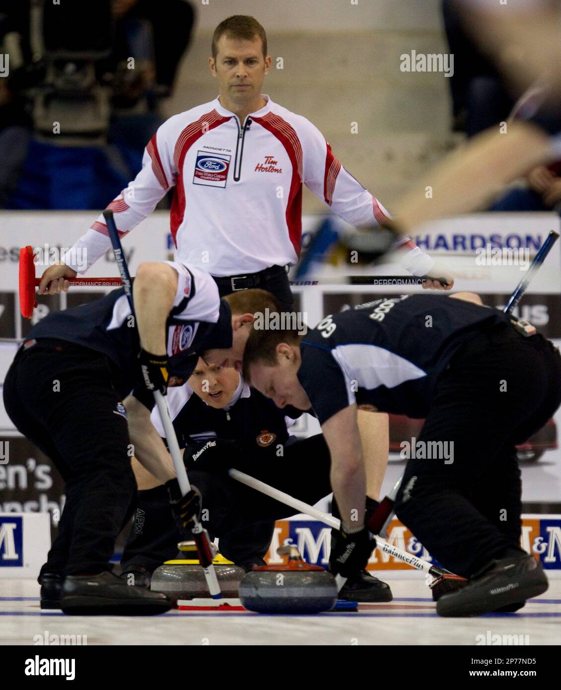 Canada's skip Jeff Stoughton watches as Scotland skip Tom Brewster ...