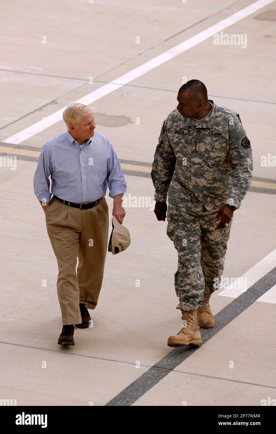 Defense Secretary Robert Gates walks with Gen. Lloyd Austin, commanding ...