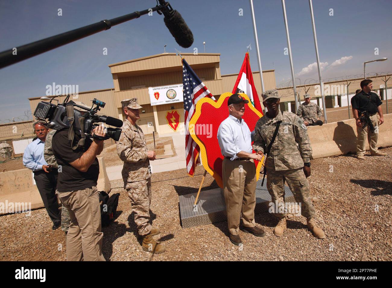 Defense Secretary Robert Gates poses for photographs with troops from ...