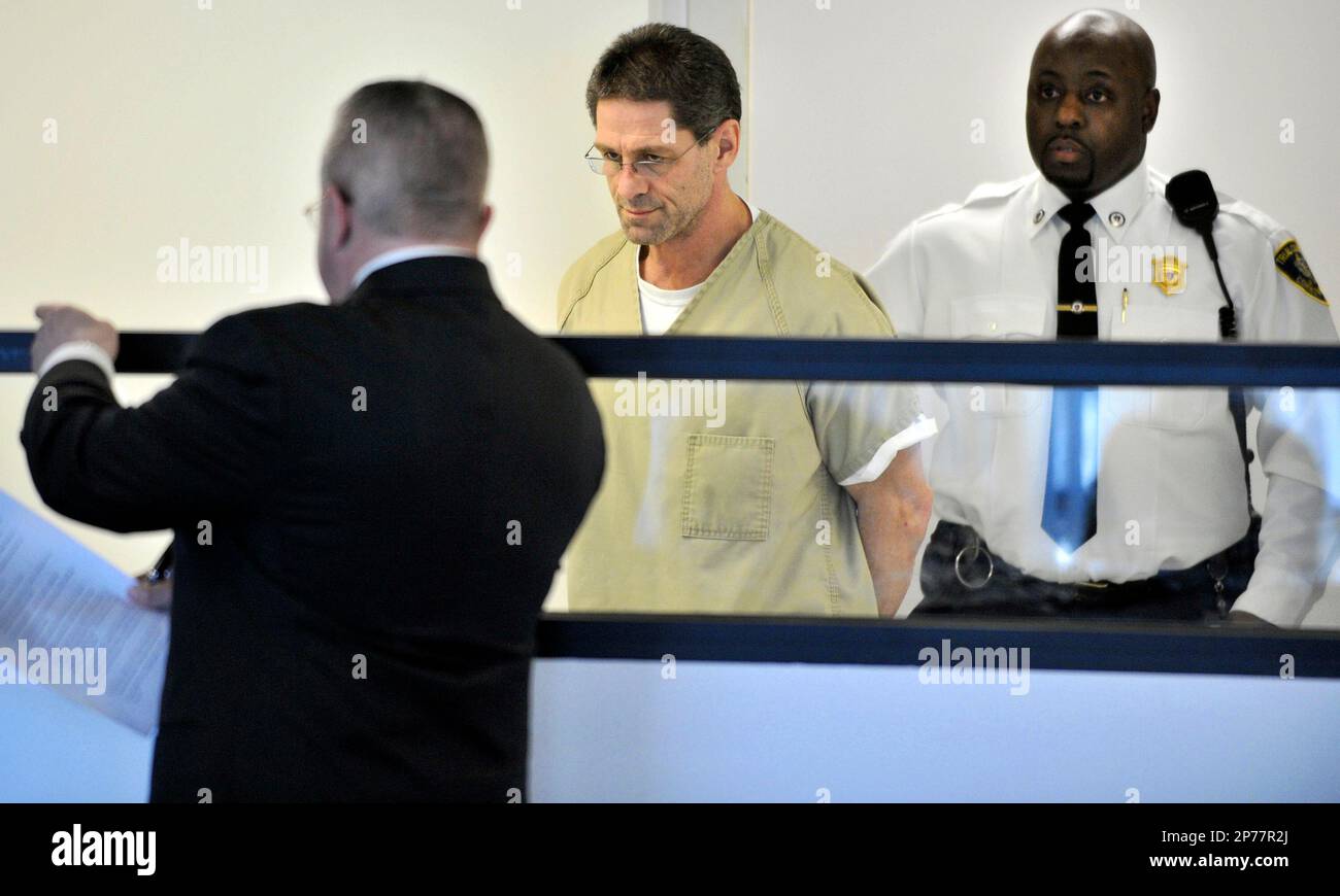 Arthur Cinelli, center, of Newburyport, Mass., enters Superior Court ...