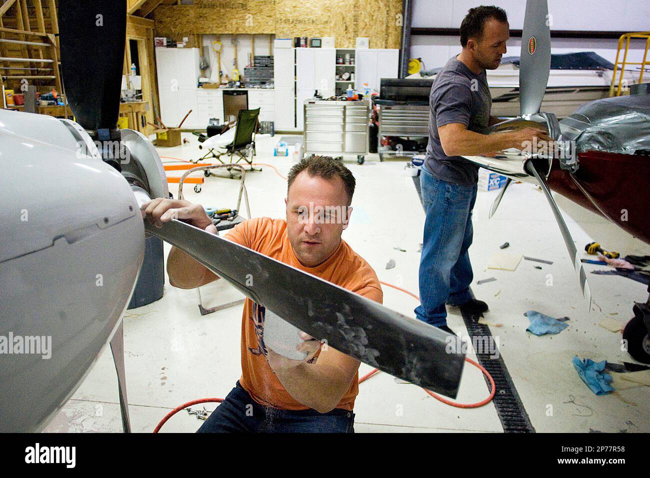 Mike Patey, left, and his twin brother, Mark, work side by side on ...