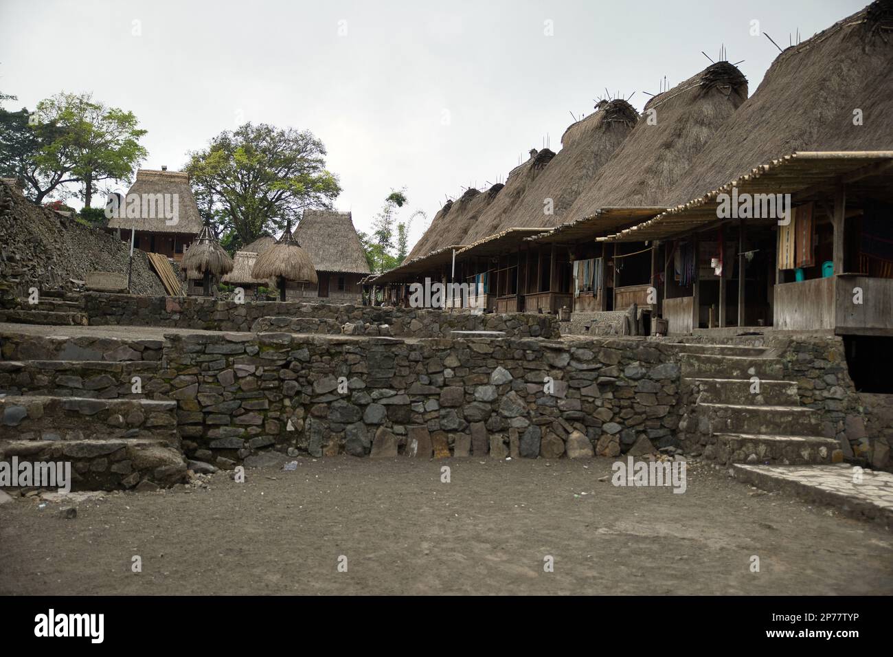 The traditional Bena Village on Flores, in the foreground a stone wall ...
