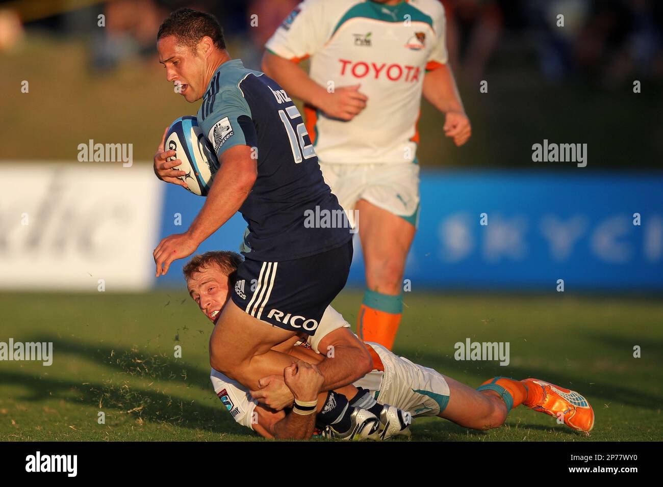 Blues' Luke McAlister is tackled by Cheetahs' Sarel Pretorius in a Super Rugby match at Toll ...