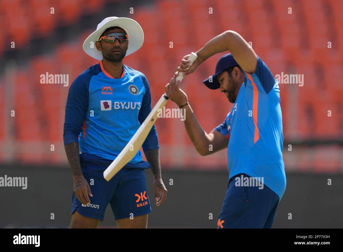 India's captain Rohit Sharma, right, swings his bat as his teammate ...