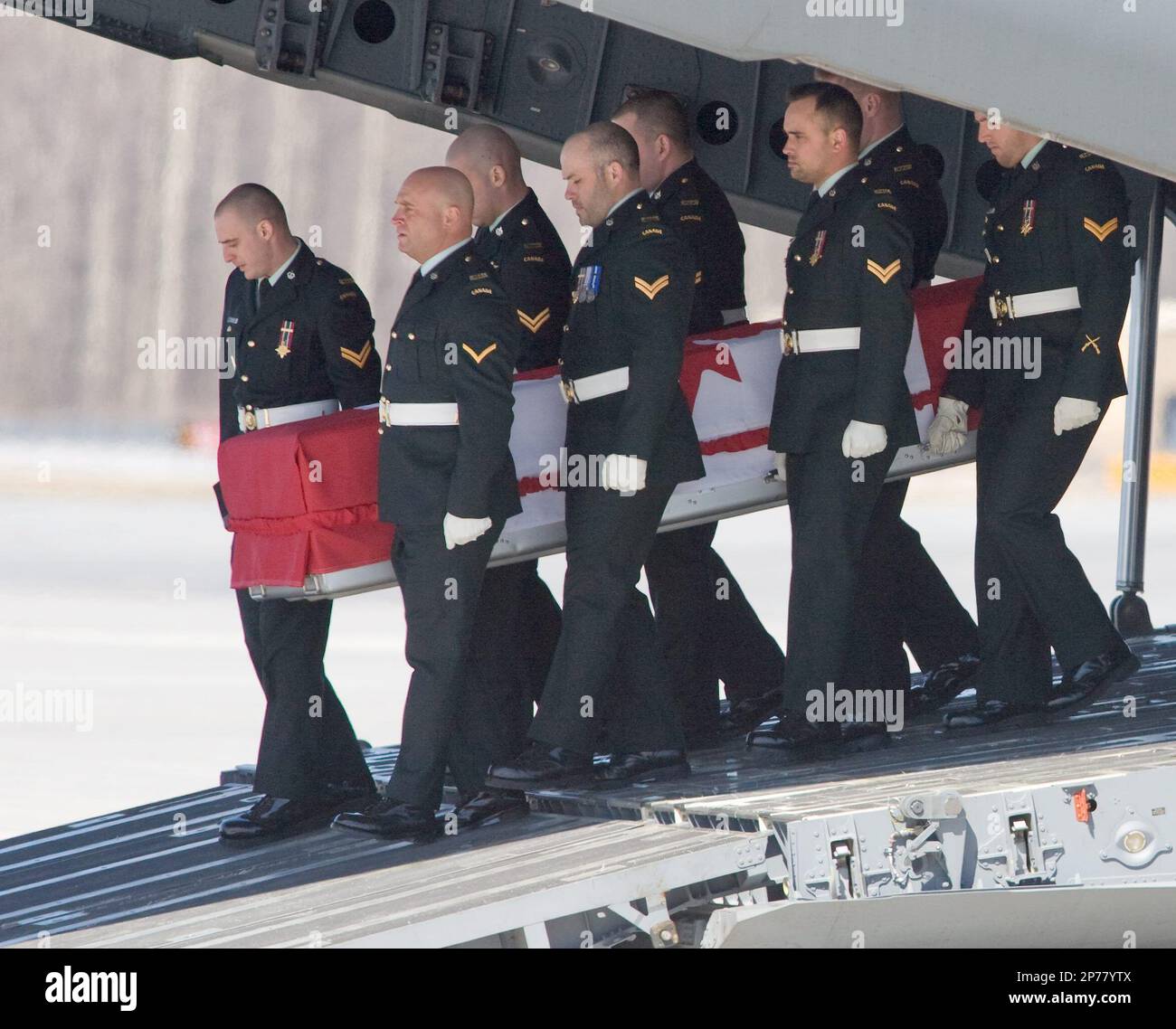 Palbearers carry the casket Canadian Cpl. Yannick Scherrer during a ...